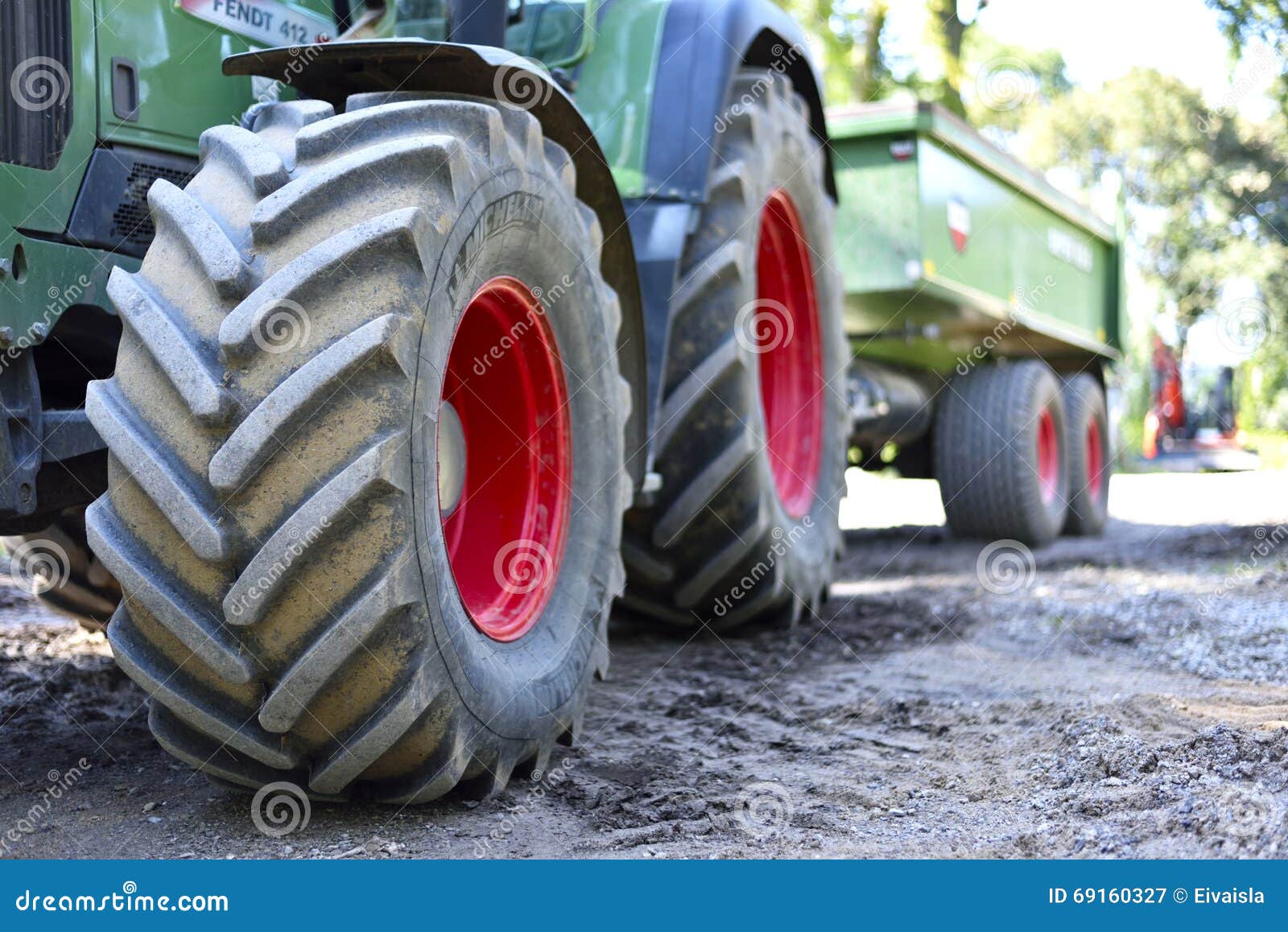 Green and Red Tractor with Big Wheels and Selective Focus. Tractor on a ...