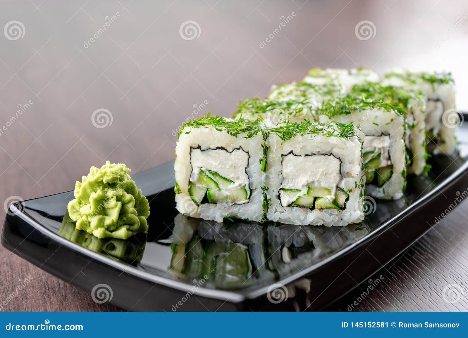 Green Rolls and Wasabi on a Black Plate Stock Image - Image of rice ...