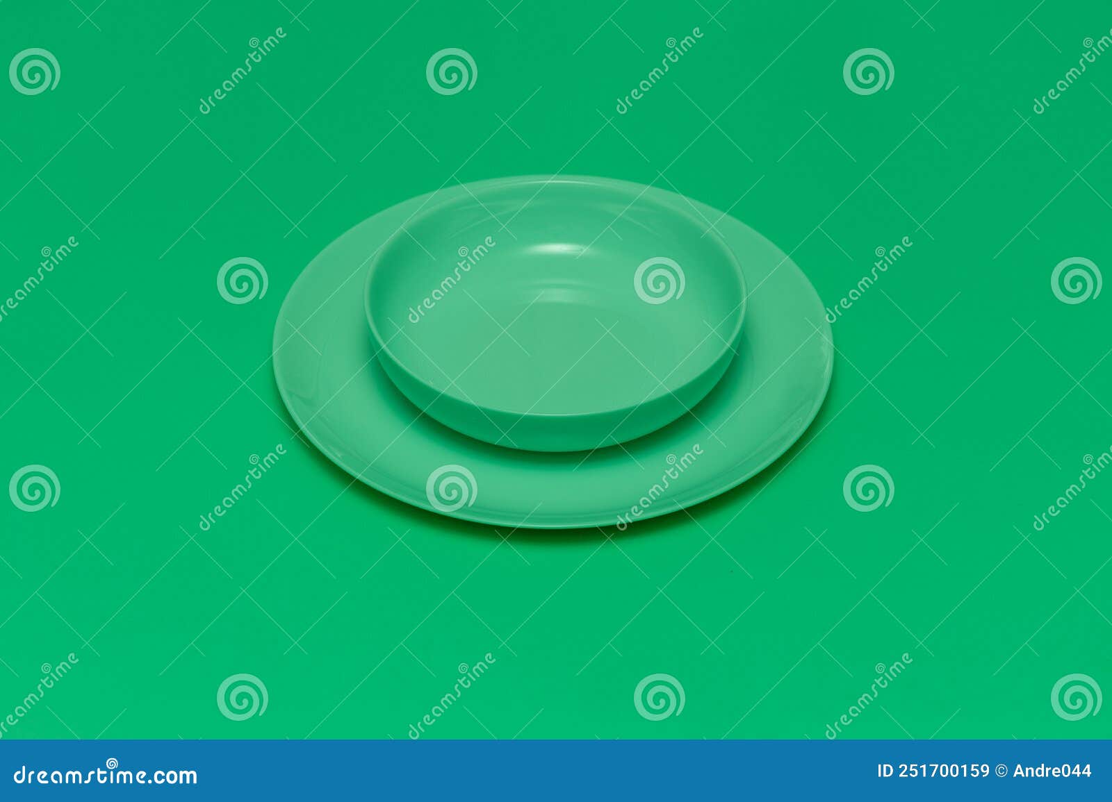 Green Round Empty Plate with a Dish on a Green Background. Stock Image ...