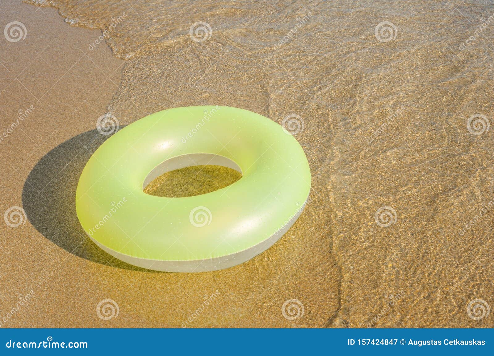 Green Rubber Ring in the Sea Stock Image - Image of ring, beach: 157424847