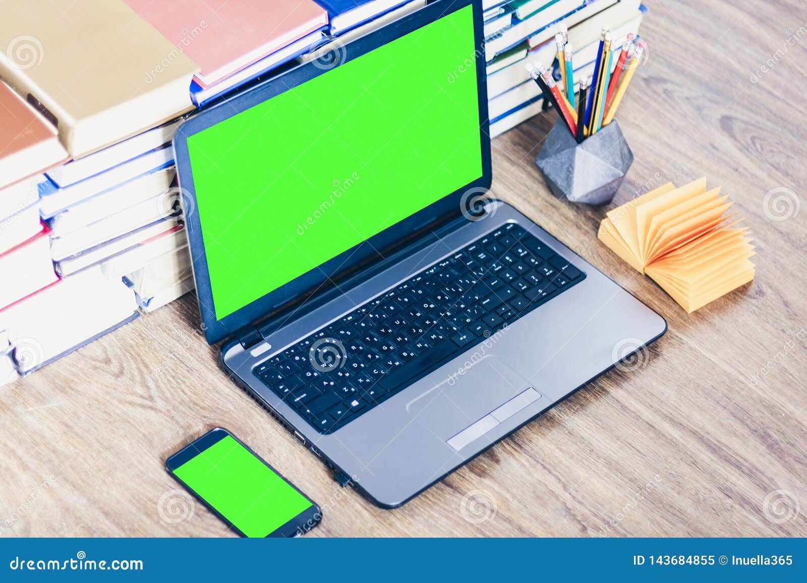 Green Screen Laptop, Stack of Books, Smartphone, Notebook and Pencils ...