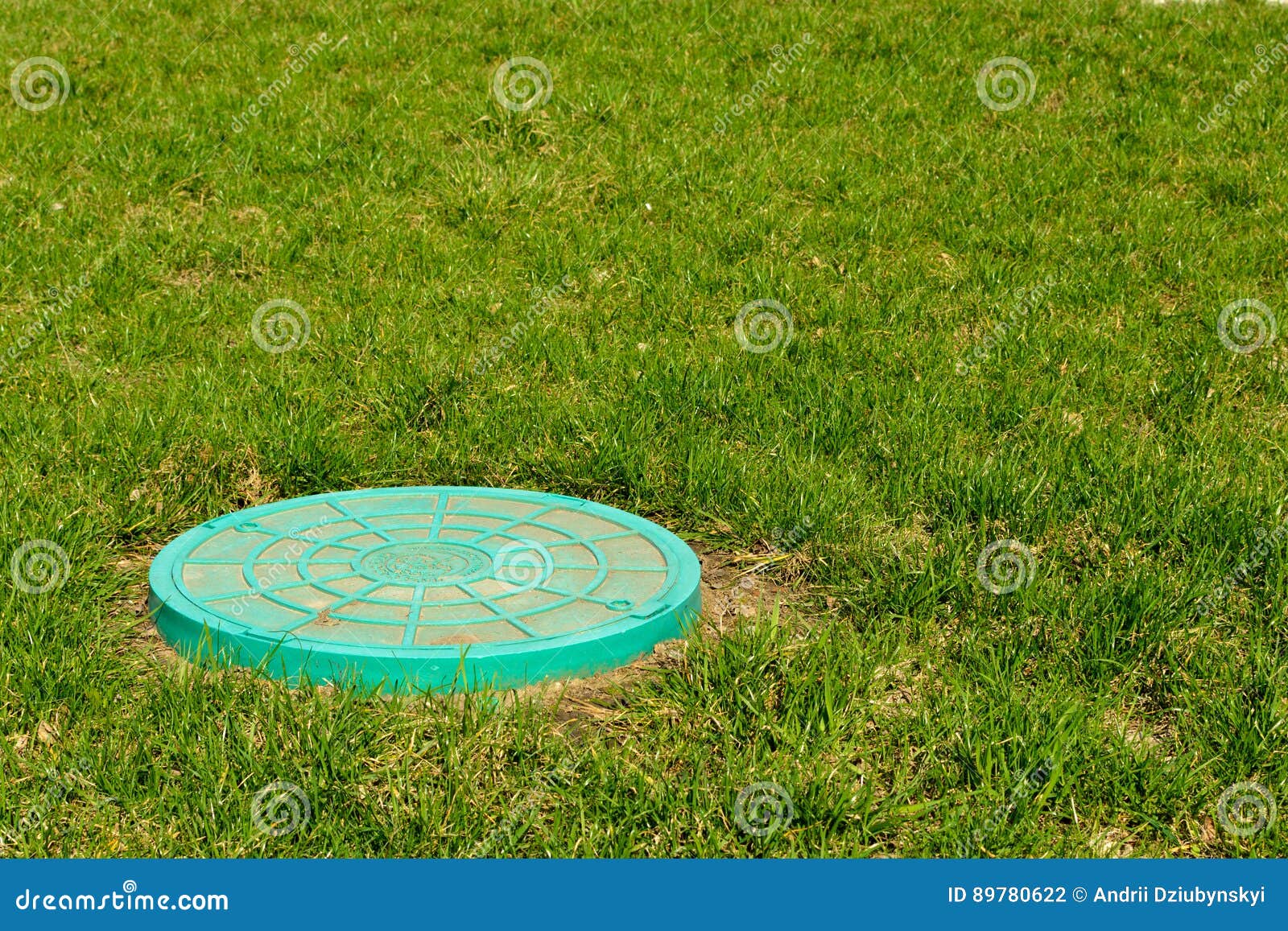 Green Sewer Hatch on Green Grass Stock Photo - Image of water, iron ...