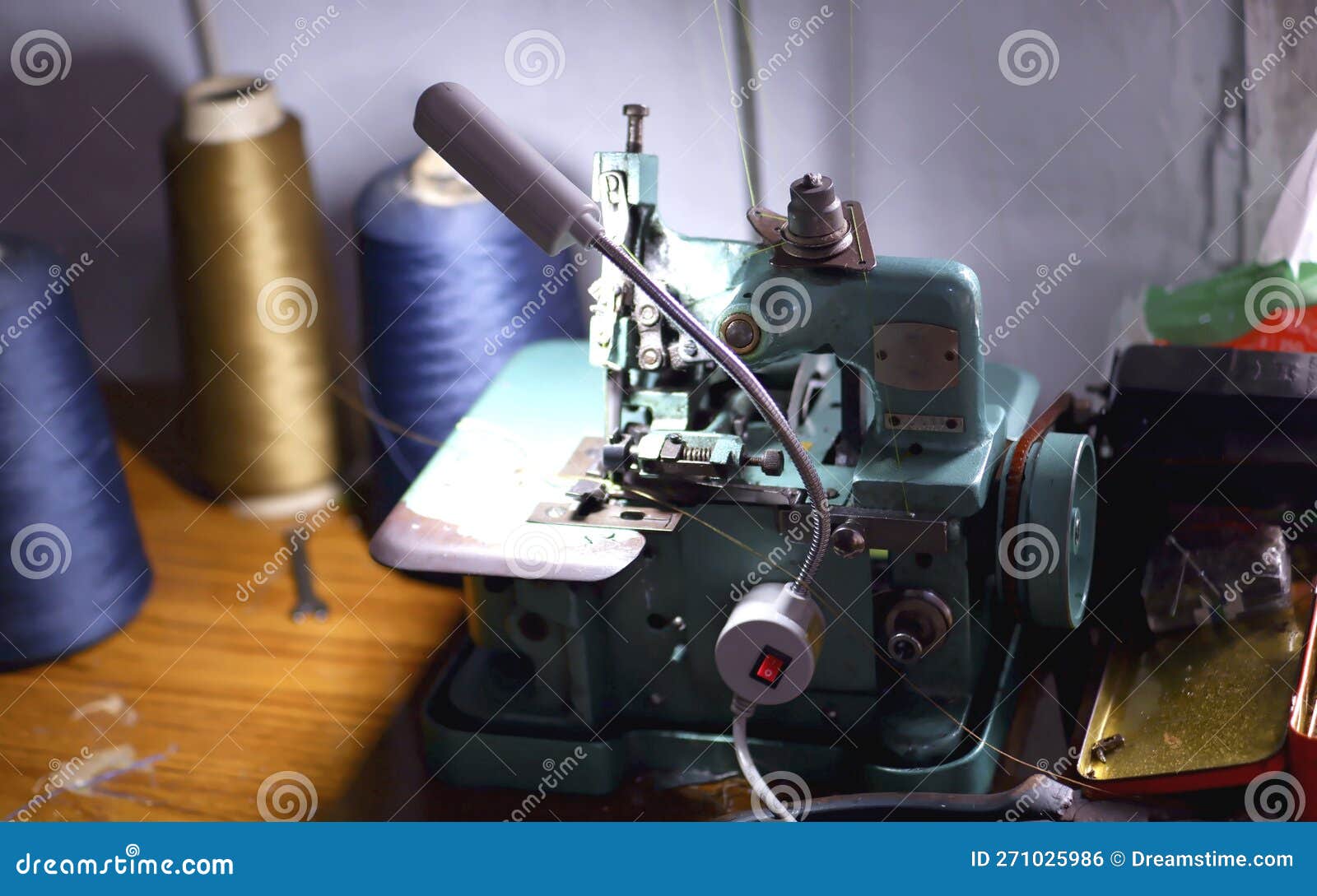 Green Sewing Machine with Lumps of Thread on the Table Stock Photo ...