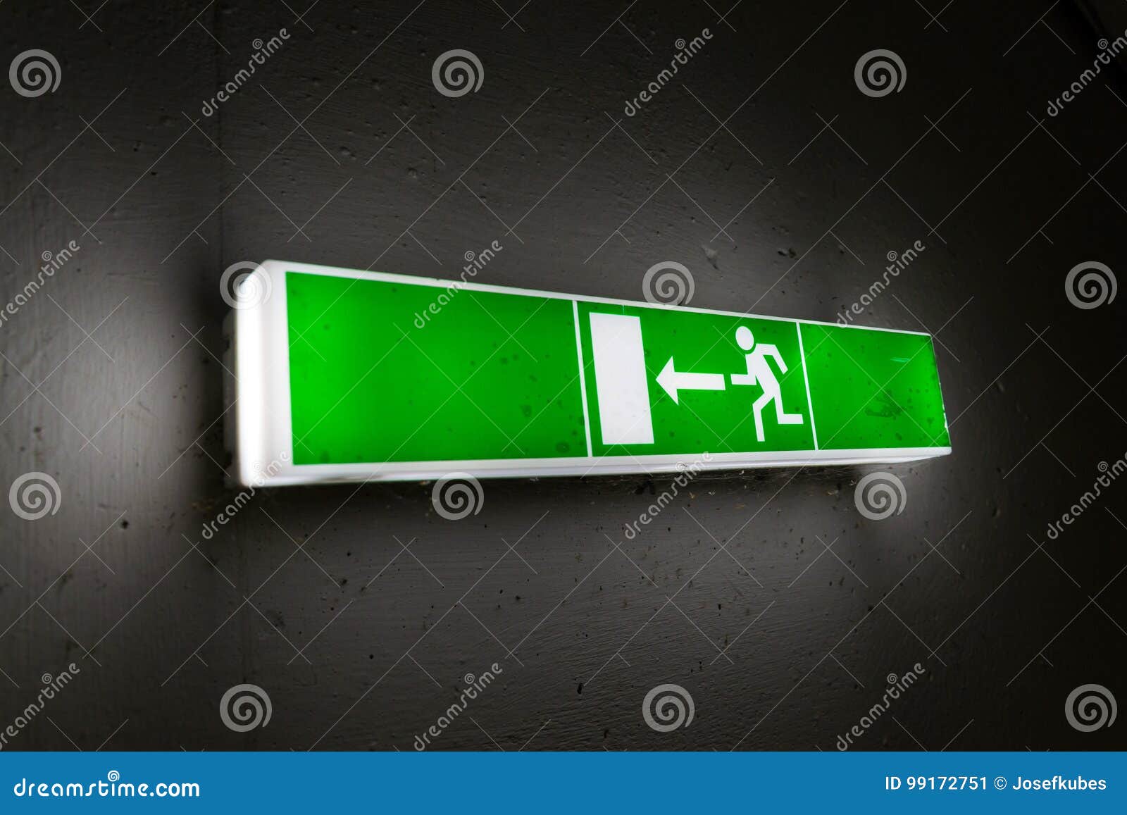 Green Escape Exit Sign on White Concrete Wall Stock Image - Image of ...
