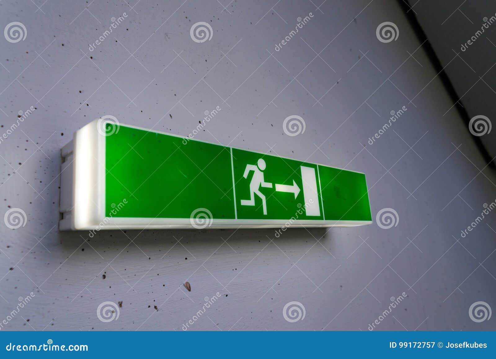 Green Escape Exit Sign on White Concrete Wall Stock Image - Image of ...