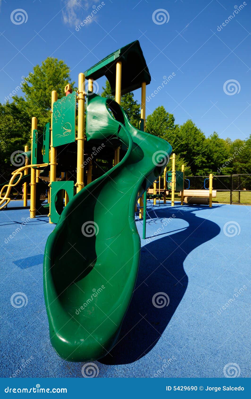Green slide, blue ground stock photo. Image of plastic - 5429690