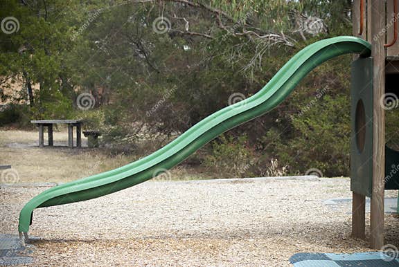 Green slide in park stock image. Image of active, equipment - 65397287