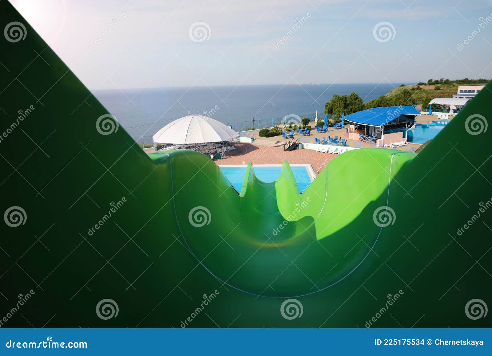 Green Slide in Water Park on Sunny Day Stock Photo - Image of enjoyment ...