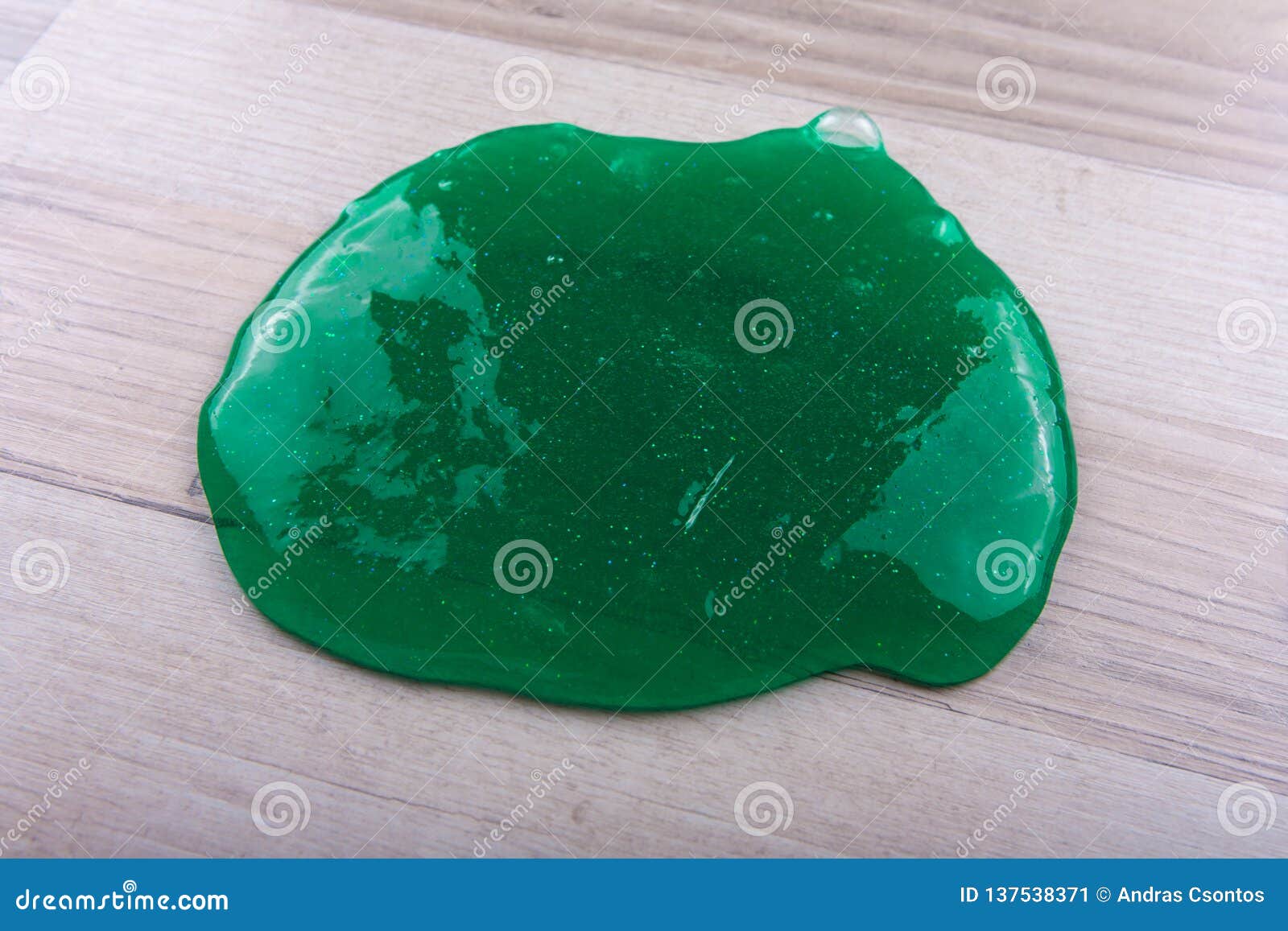 Green slime on a table stock image. Image of abstract - 137538371