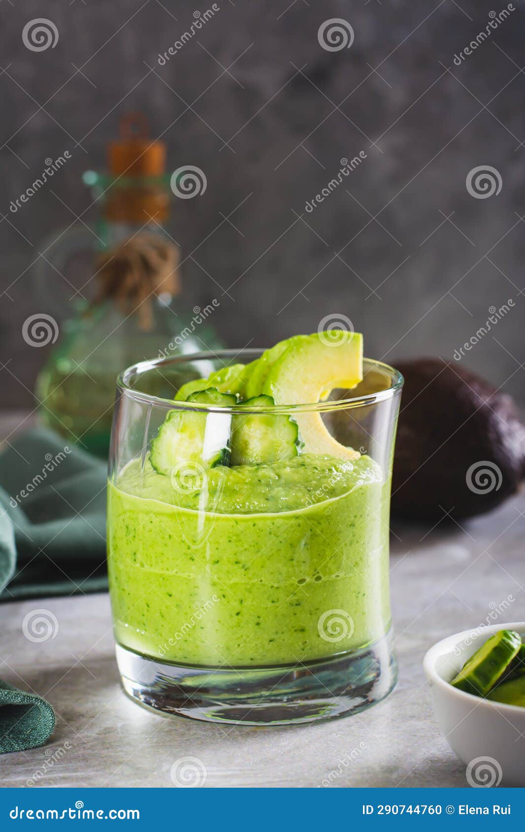 Green Smoothie from Avocado and Cucumbers in a Glass on the Table ...