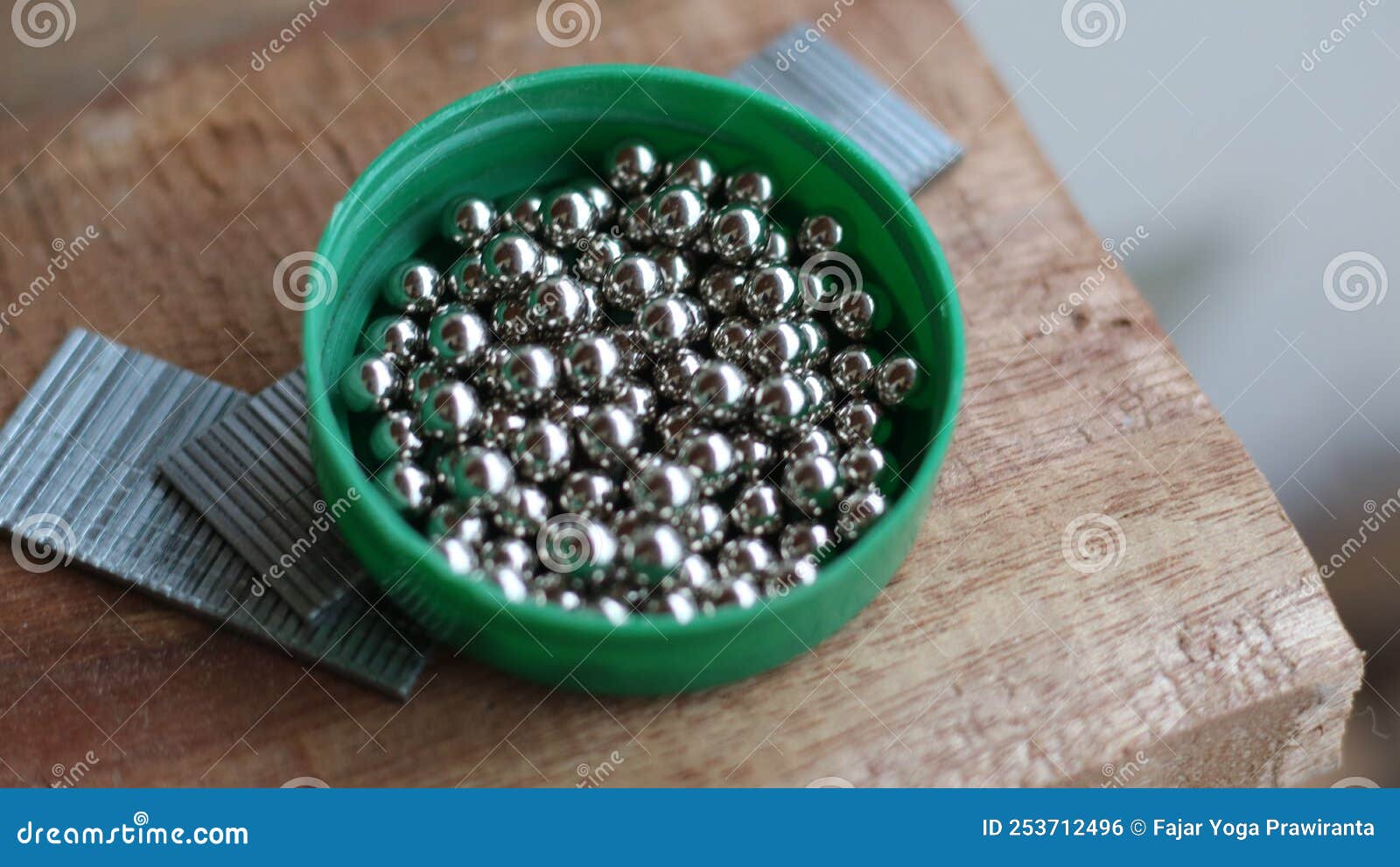 Two Bullets With A Stainless Revolver In The Background Royalty-Free ...