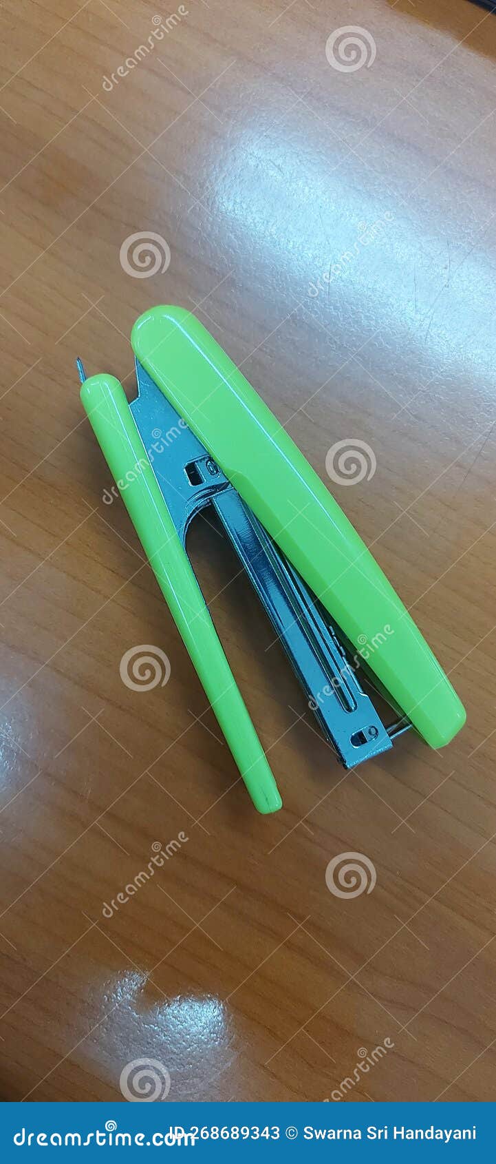 Green Stapler on the Top of the Table Stock Image - Image of stapler ...