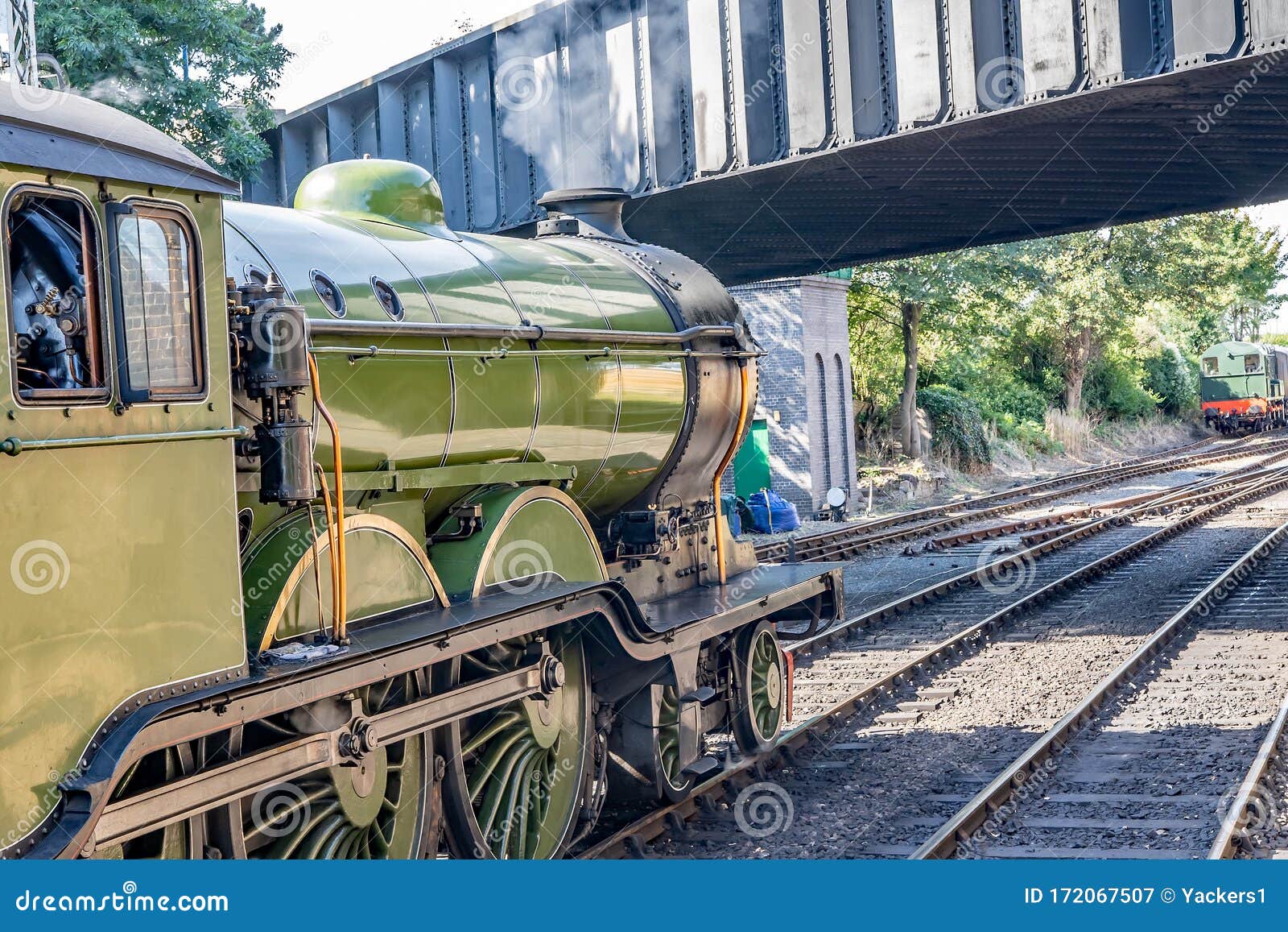 Side View of a Green Steam Train on the Rail Tracks Stock Image - Image ...