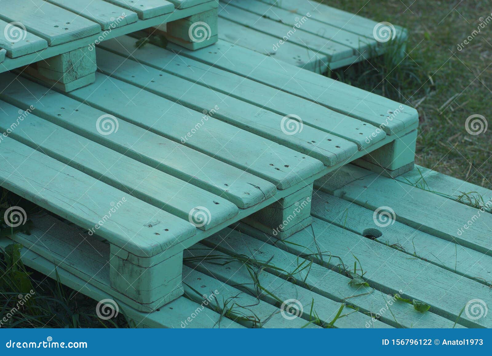 Steps of Wooden Pallets on the Grass Stock Photo - Image of group ...