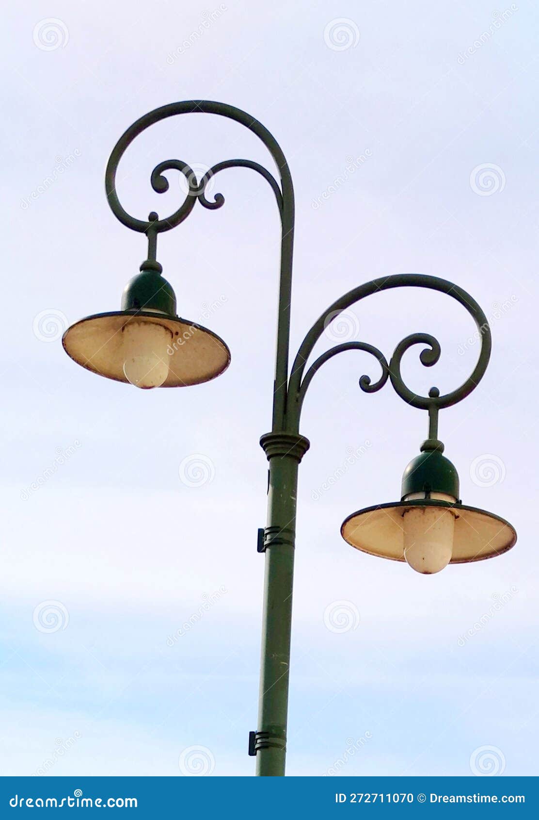 Green Streetlight with Two Separate Lights Suspended from the Frame ...