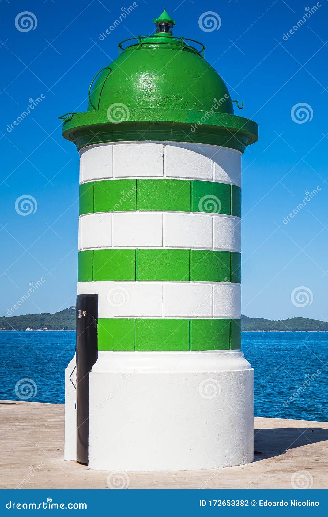 Green striped lighthouse stock photo. Image of sunny - 172653382