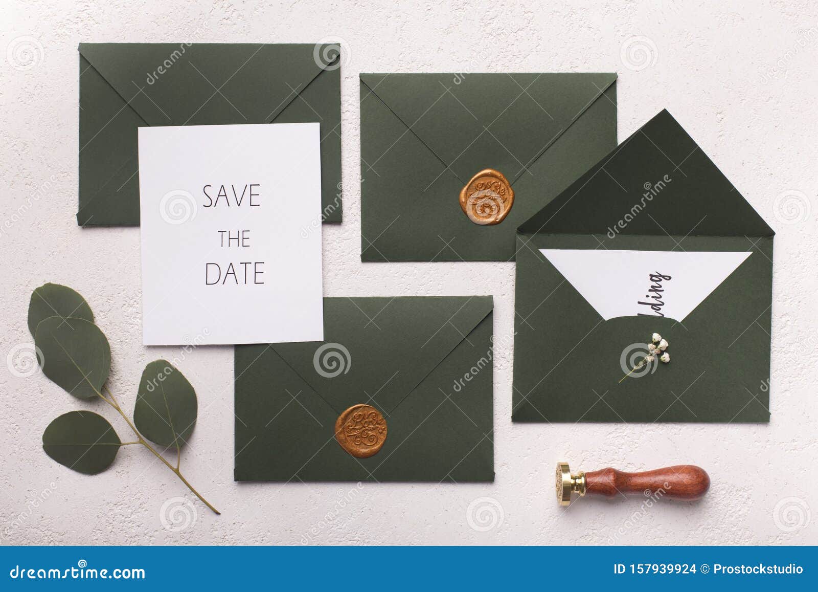Green Stylish Envelopes with Wedding Postcards on White Stock Photo ...