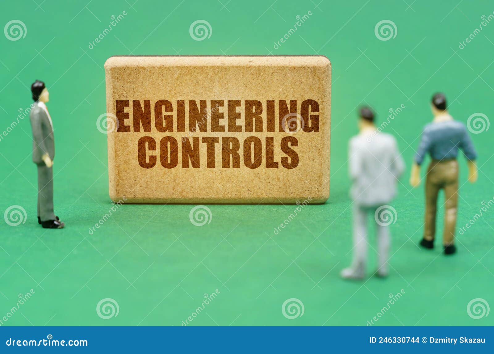 On the Green Surface are Figures of People and a Sign with the ...