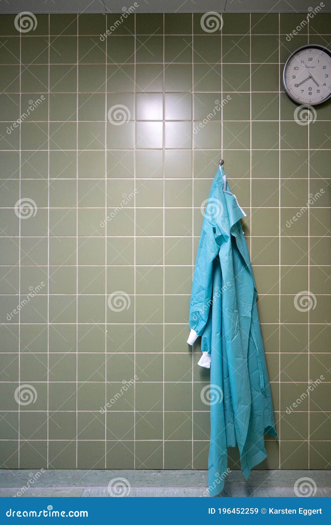 Green Surgical Gown is Hanging on a Wall in an Operating Room Stock ...