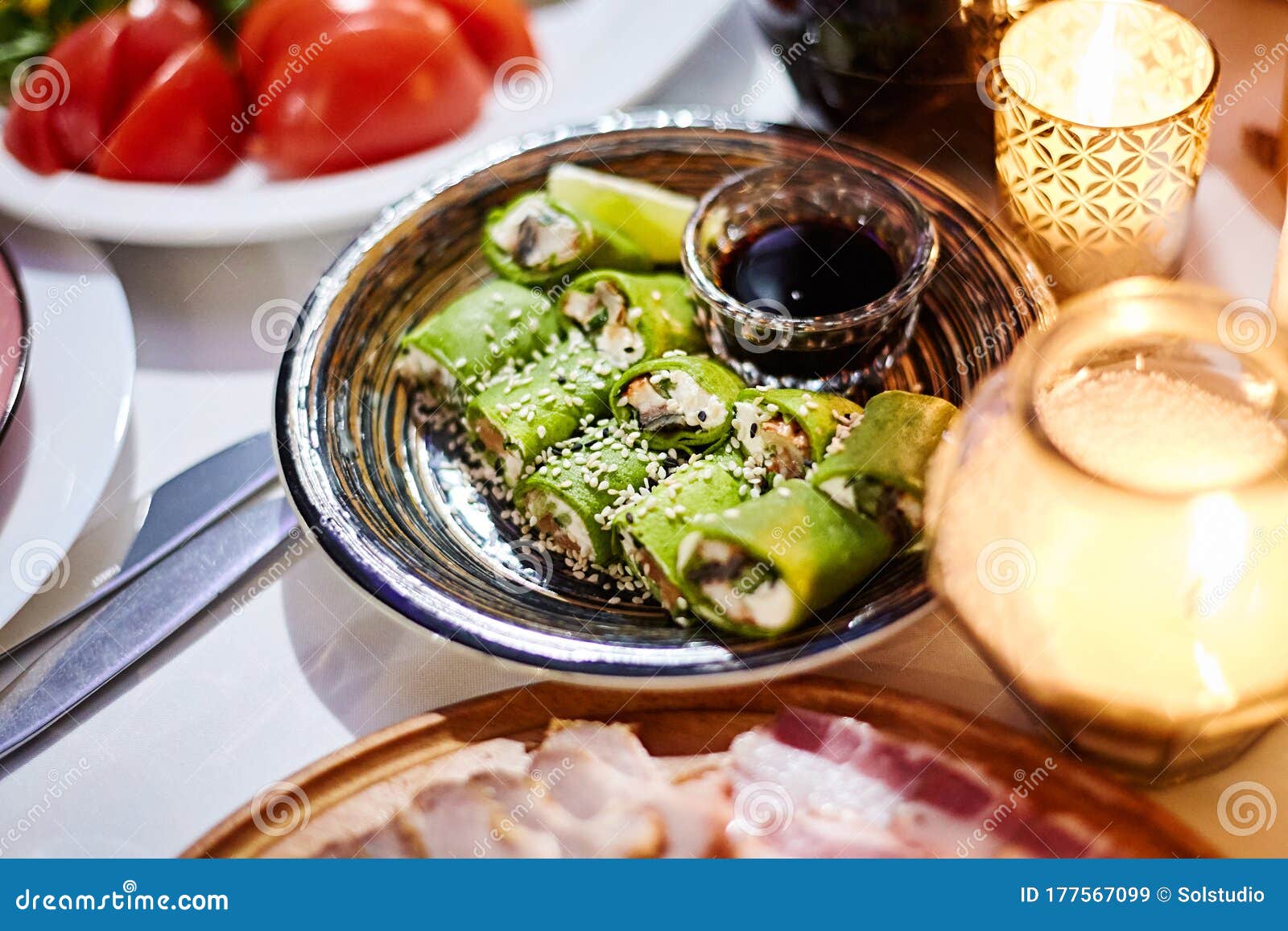 Green sushi rolls stock image. Image of salmon, green - 177567099