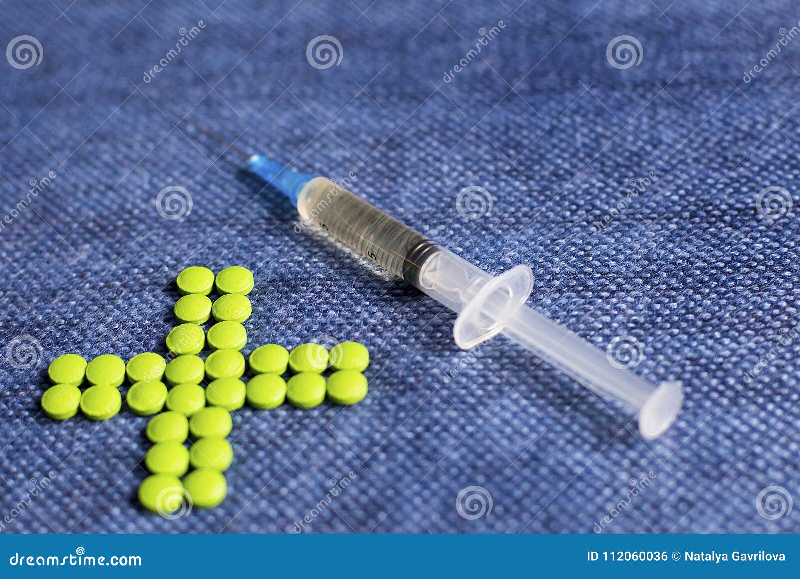 Green Tablets in the Form of a Cross and Syringe Stock Photo - Image of ...