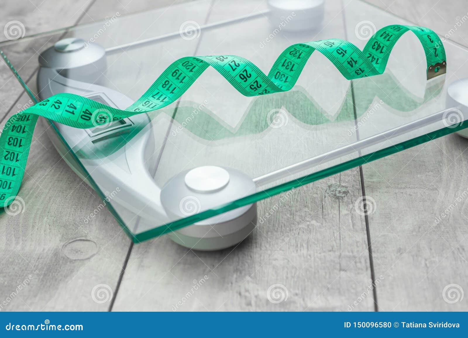 Green Tape Measure on a Weighing Scale Stock Photo - Image of glass ...