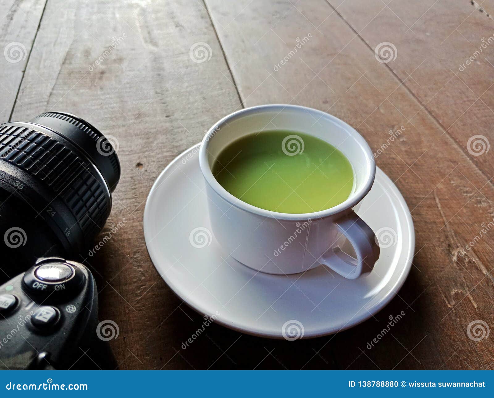 Green tea and camera stock photo. Image of breakfast - 138788880