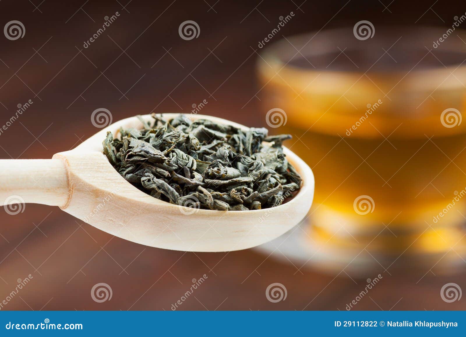 Green Tea Leaves in Wooden Spoon, Cup of Tea Stock Photo - Image of ...