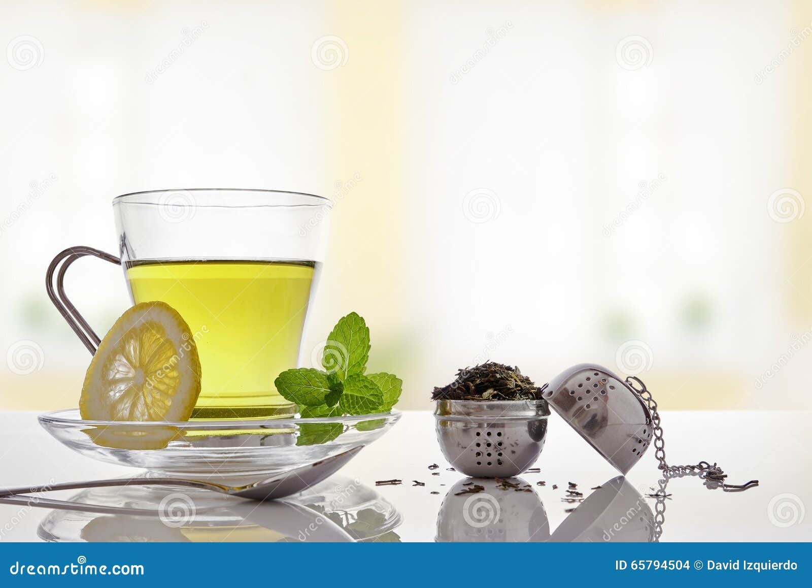 Green Tea with Mint and Lemon with Strainer Front View Stock Photo ...