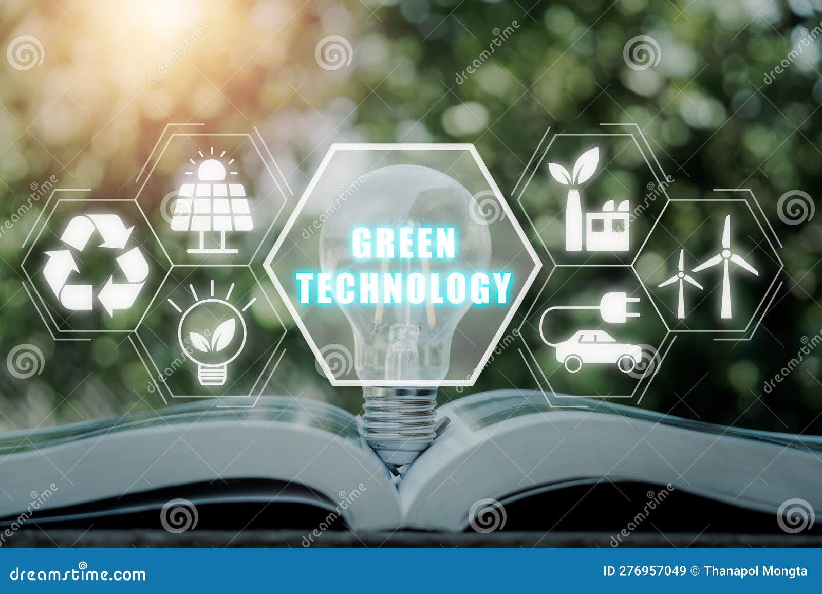 Light Bulb on Book with Green Technology Icon on Virtual Screen Stock ...