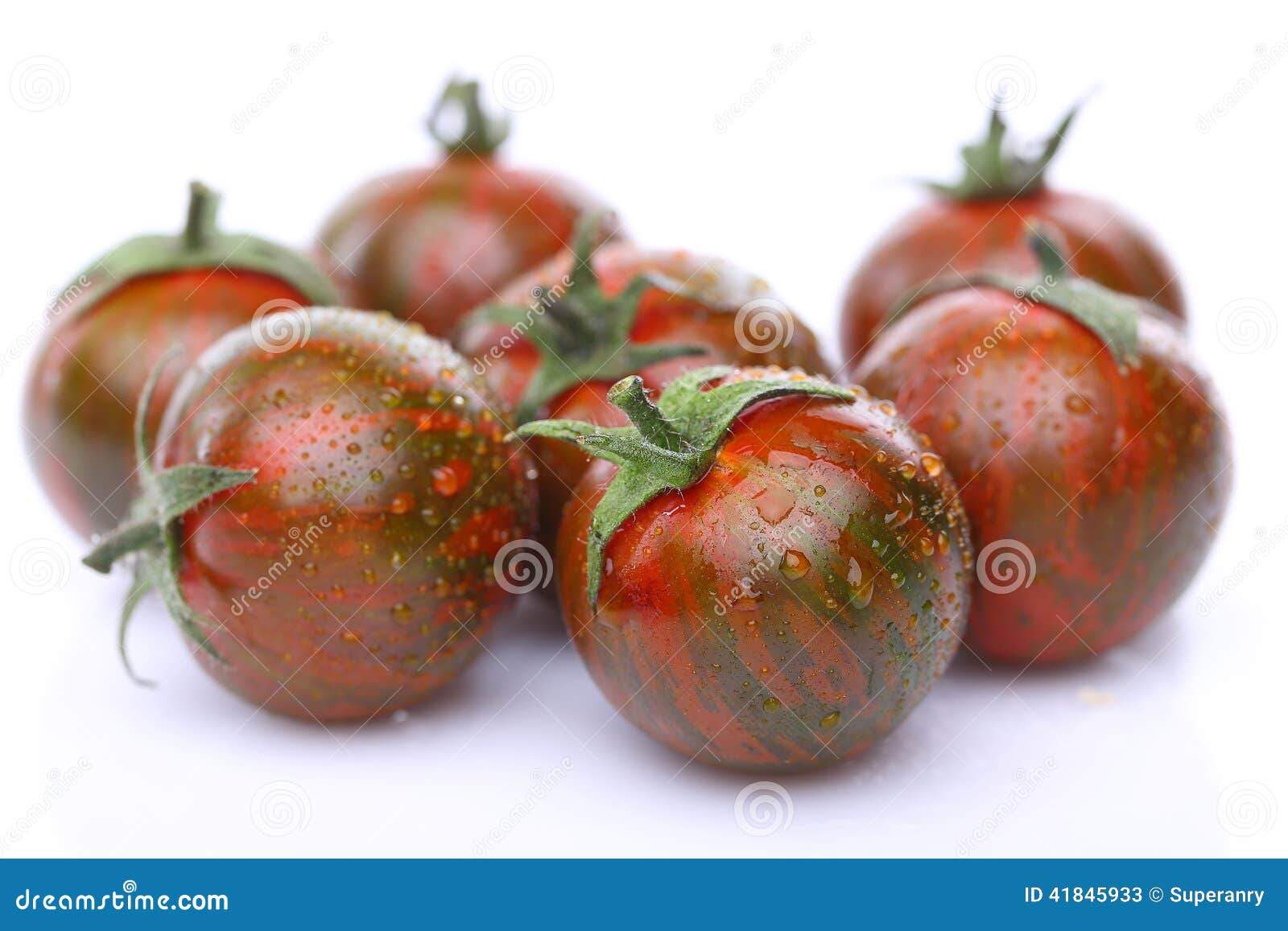 Green tiger tomato is wet stock image. Image of strip - 41845933