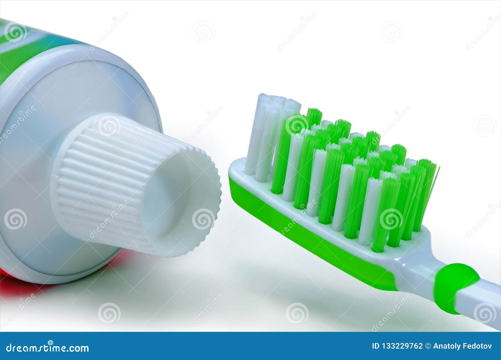 Green Toothbrush and Toothpaste are Isolated on a White Background ...