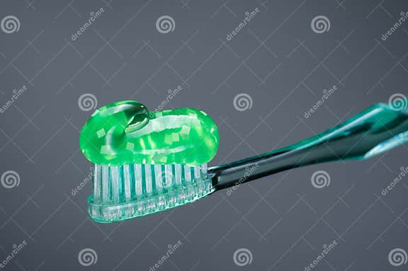 Green Toothpaste. Toothpaste on a Toothbrush. Toothpaste with Additives ...