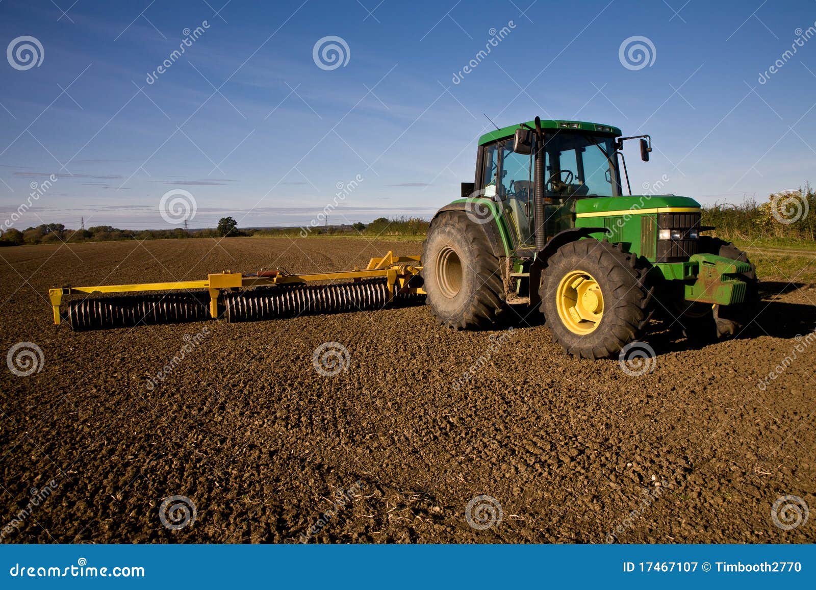 Green Tractor with Harrow on Tilled Field Editorial Photography - Image ...