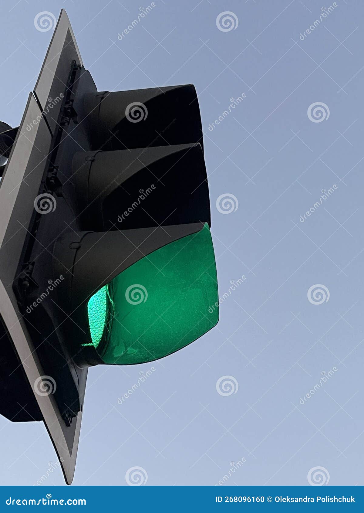 Traffic Lights Glowing Green Against Evening Sky Stock Photo - Image of ...