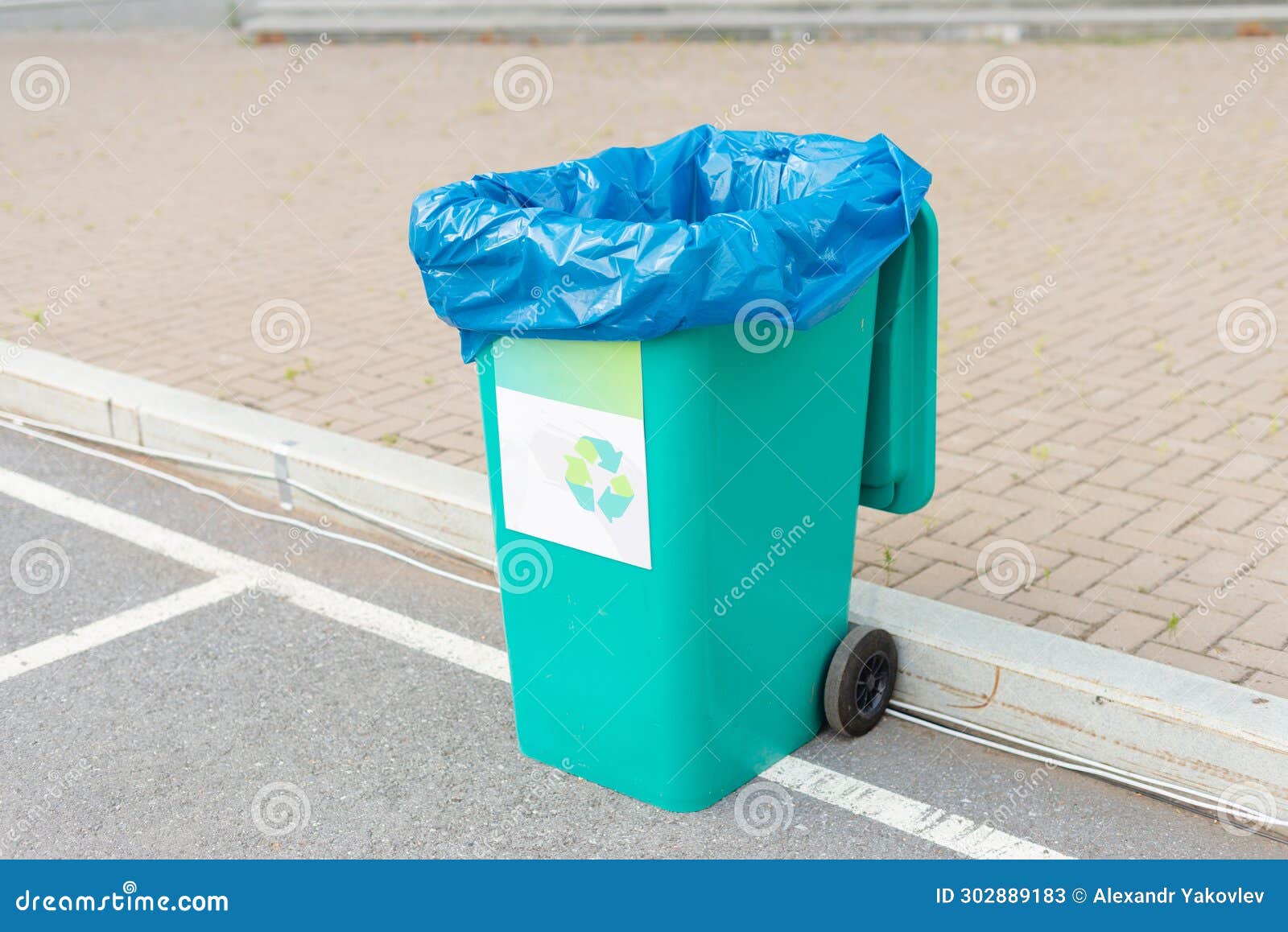 A Green Trash Container Designed To Collect Recyclable Waste Stock ...