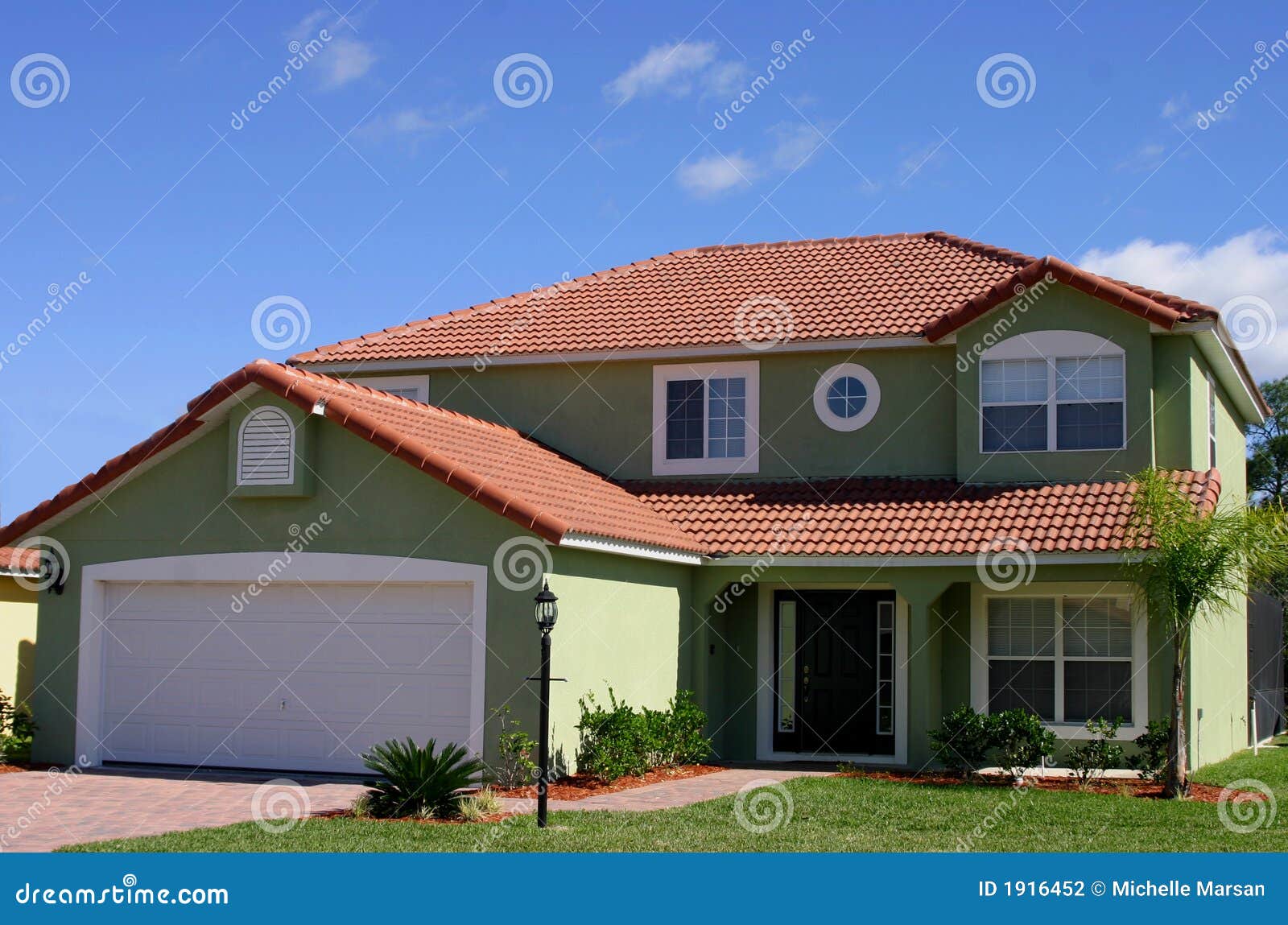 Green two story home stock photo. Image of levels, windows - 1916452