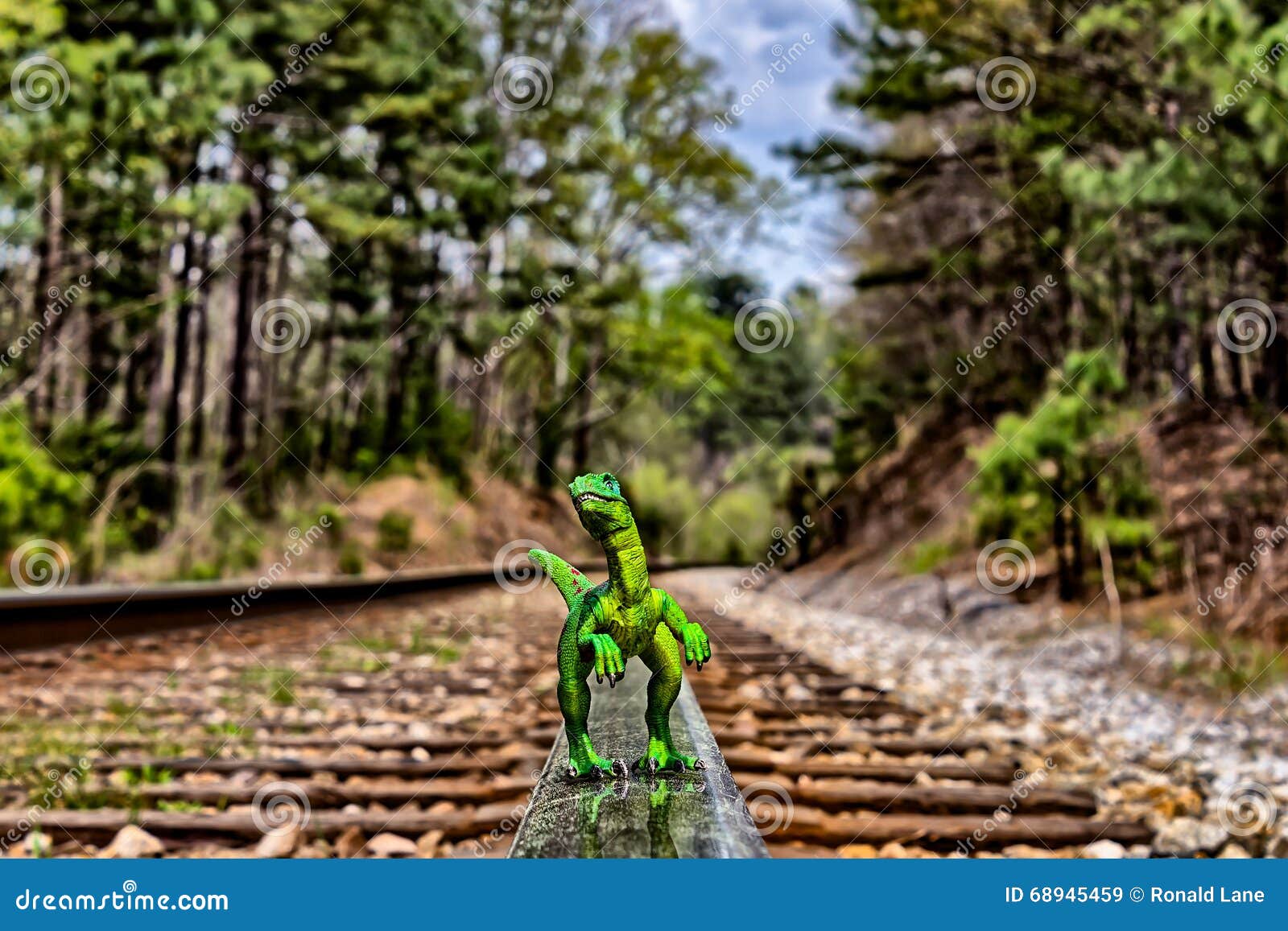 Green Velociraptor Dinosaur Walking on Rail Railroad Tracks Stock Image ...
