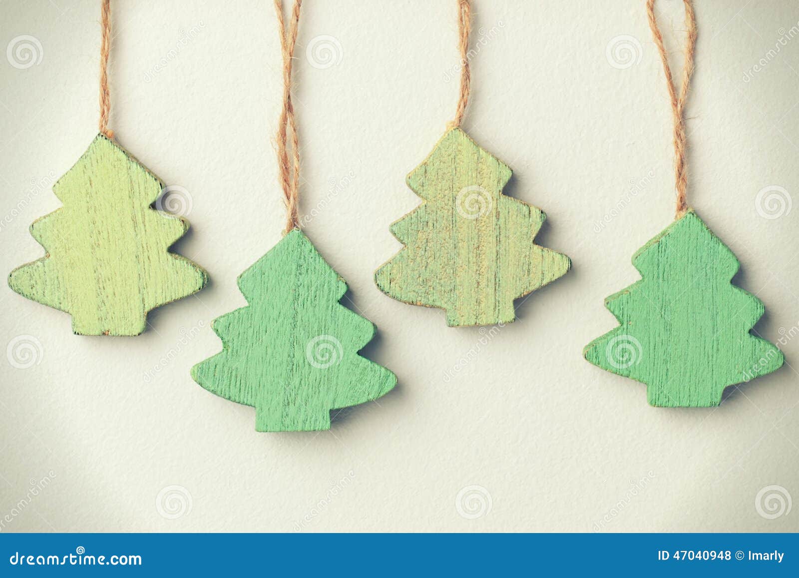 Green Vintage Wooden Christmas Trees Hanging on String Stock Photo ...