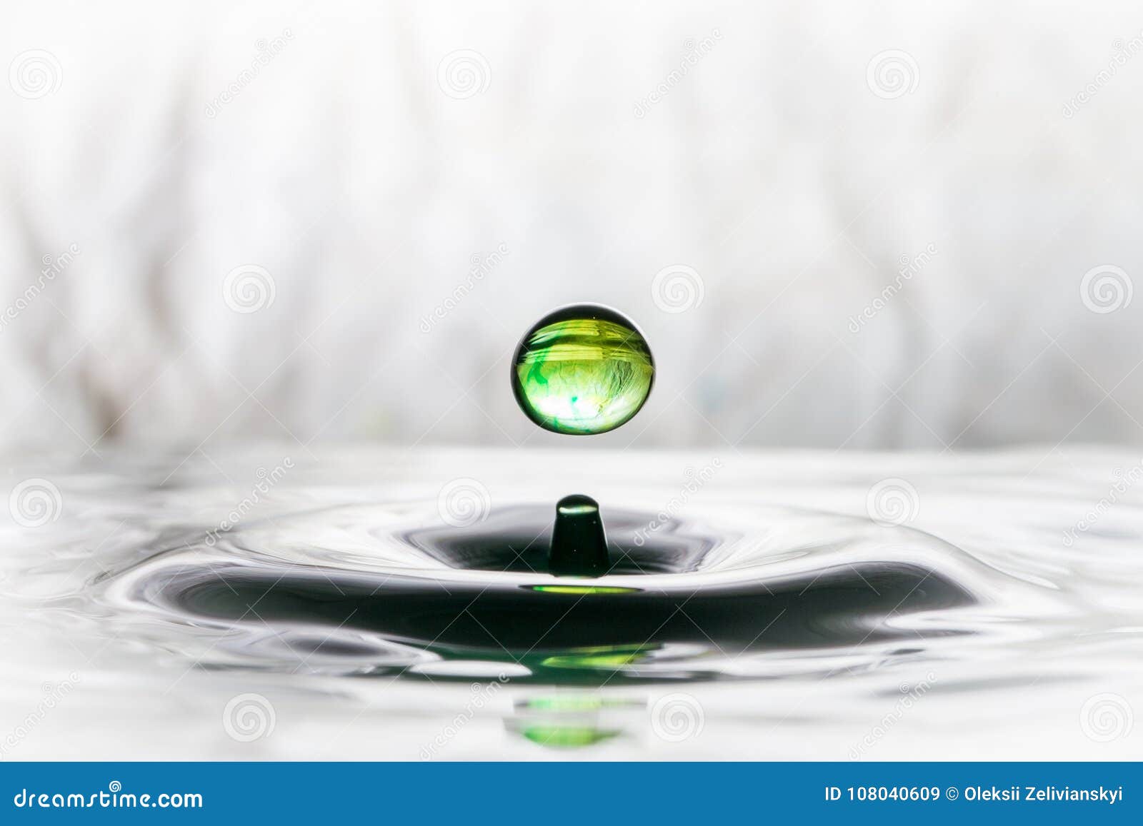Green water drop bouncing stock image. Image of surface - 108040609