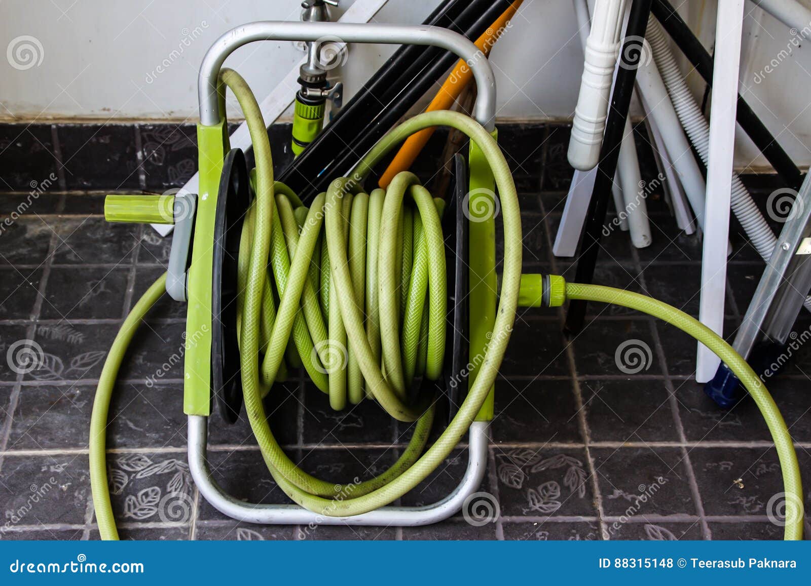 Green Water Hose on the Floor Stock Photo - Image of nature, tube: 88315148