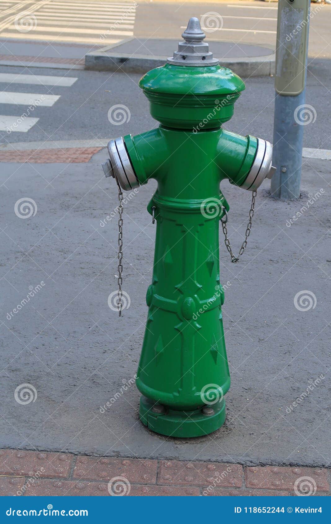 A Green Water Hydrant with Two Outlet Pipes by a Roadside Stock Photo ...