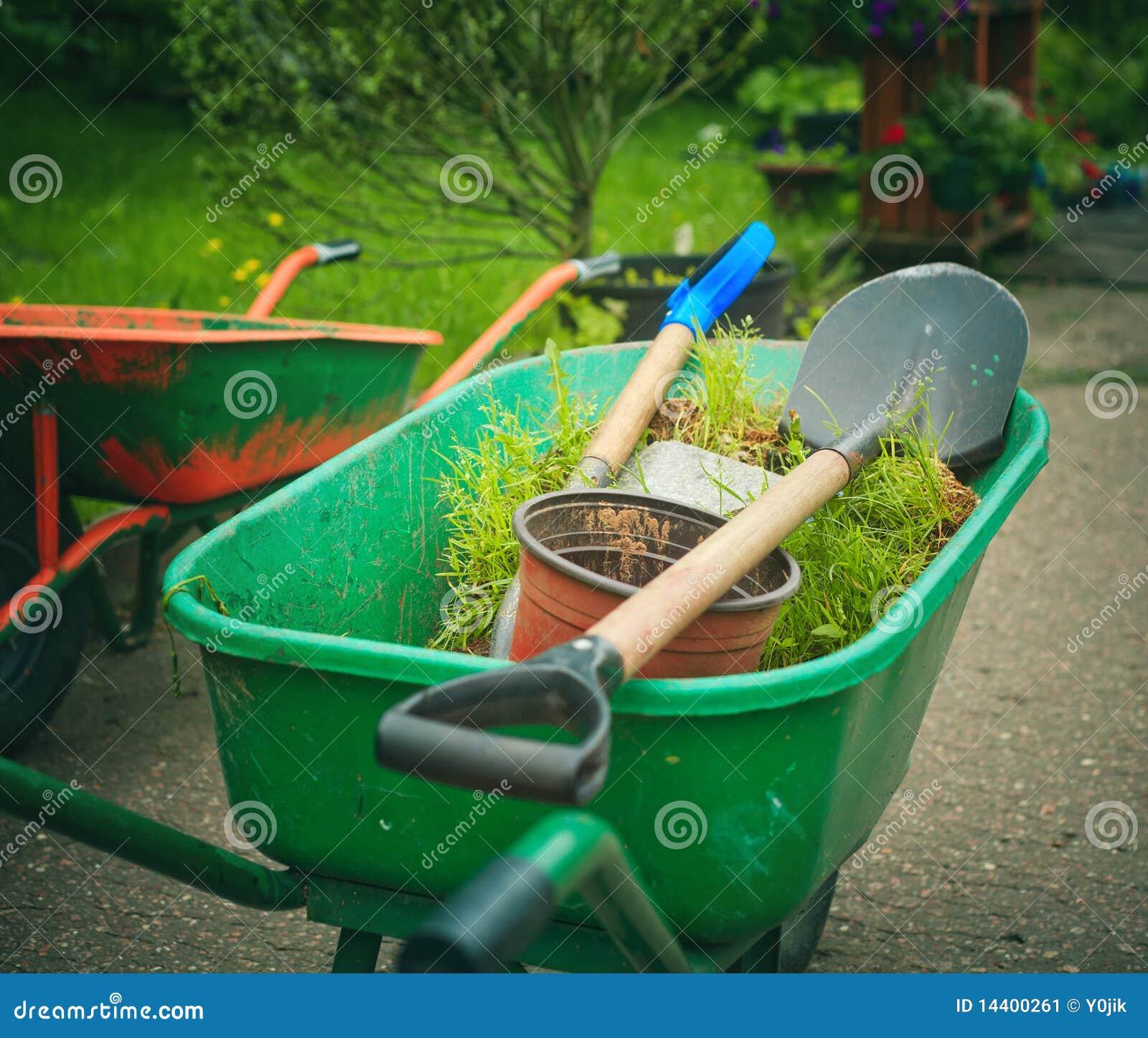 Green wheelbarrow stock image. Image of spring, garden - 14400261