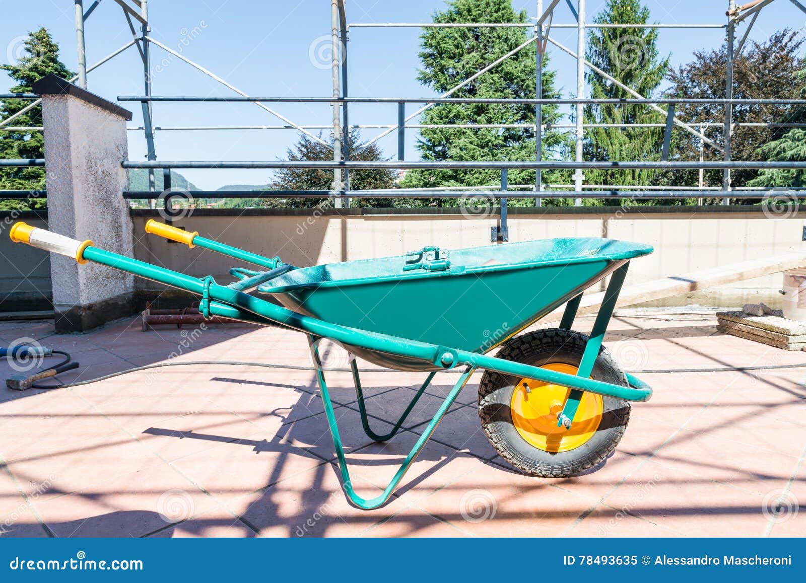 Green wheelbarrow stock image. Image of construction - 78493635