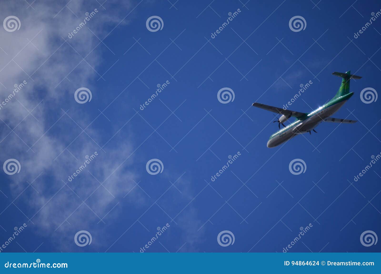 Green and White Double Helix Regional Airplane Flying Left Editorial ...