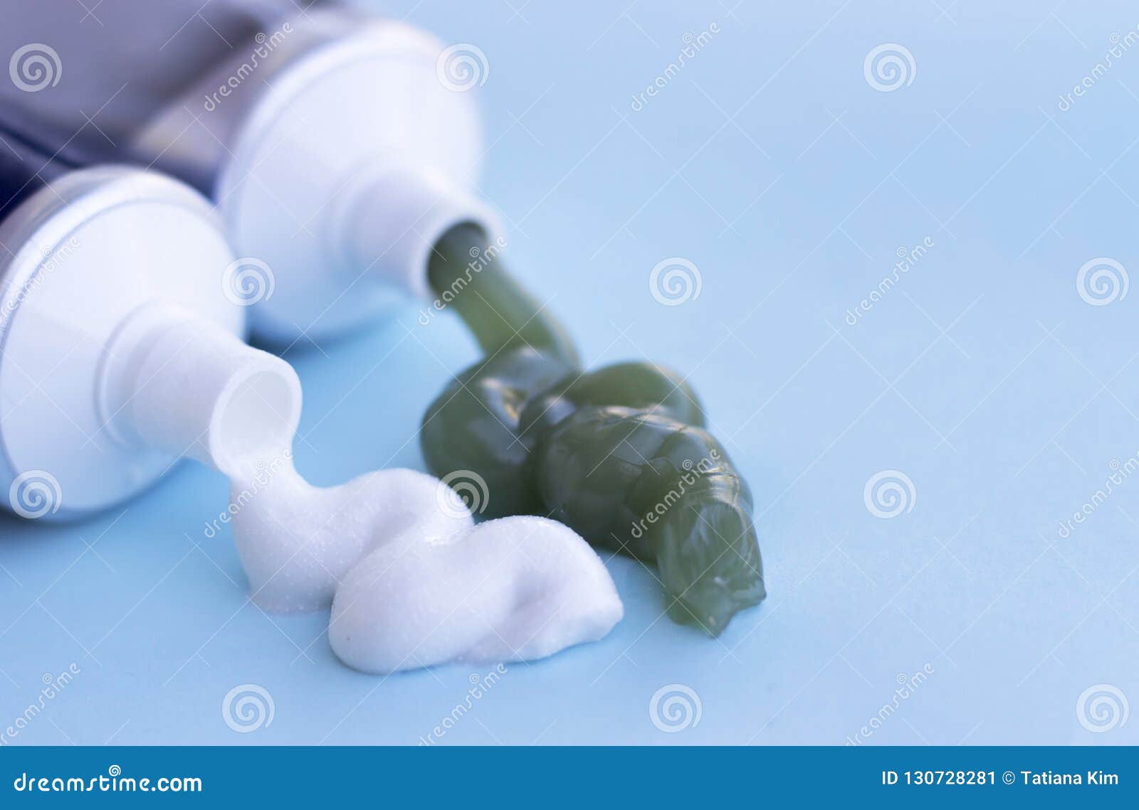 Green and White Toothpaste Squeezed Out of Tubes on Blue Background ...