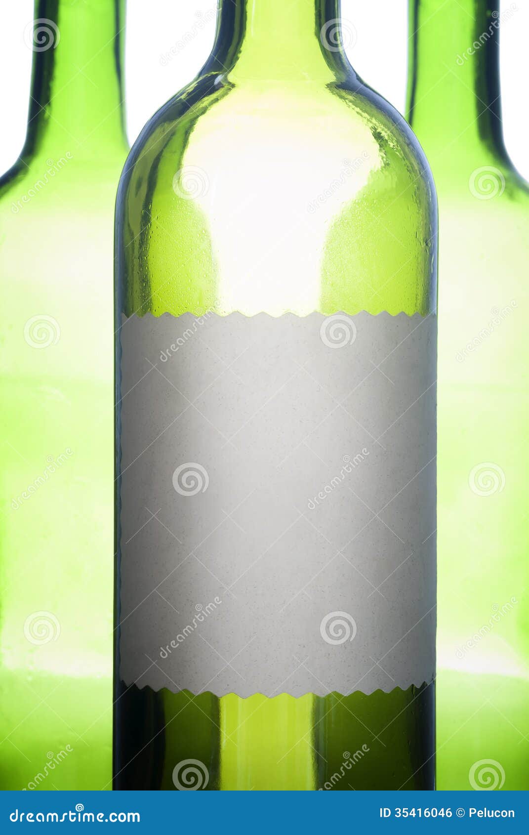 Green Wine Bottles with Label Stock Photo - Image of standing ...