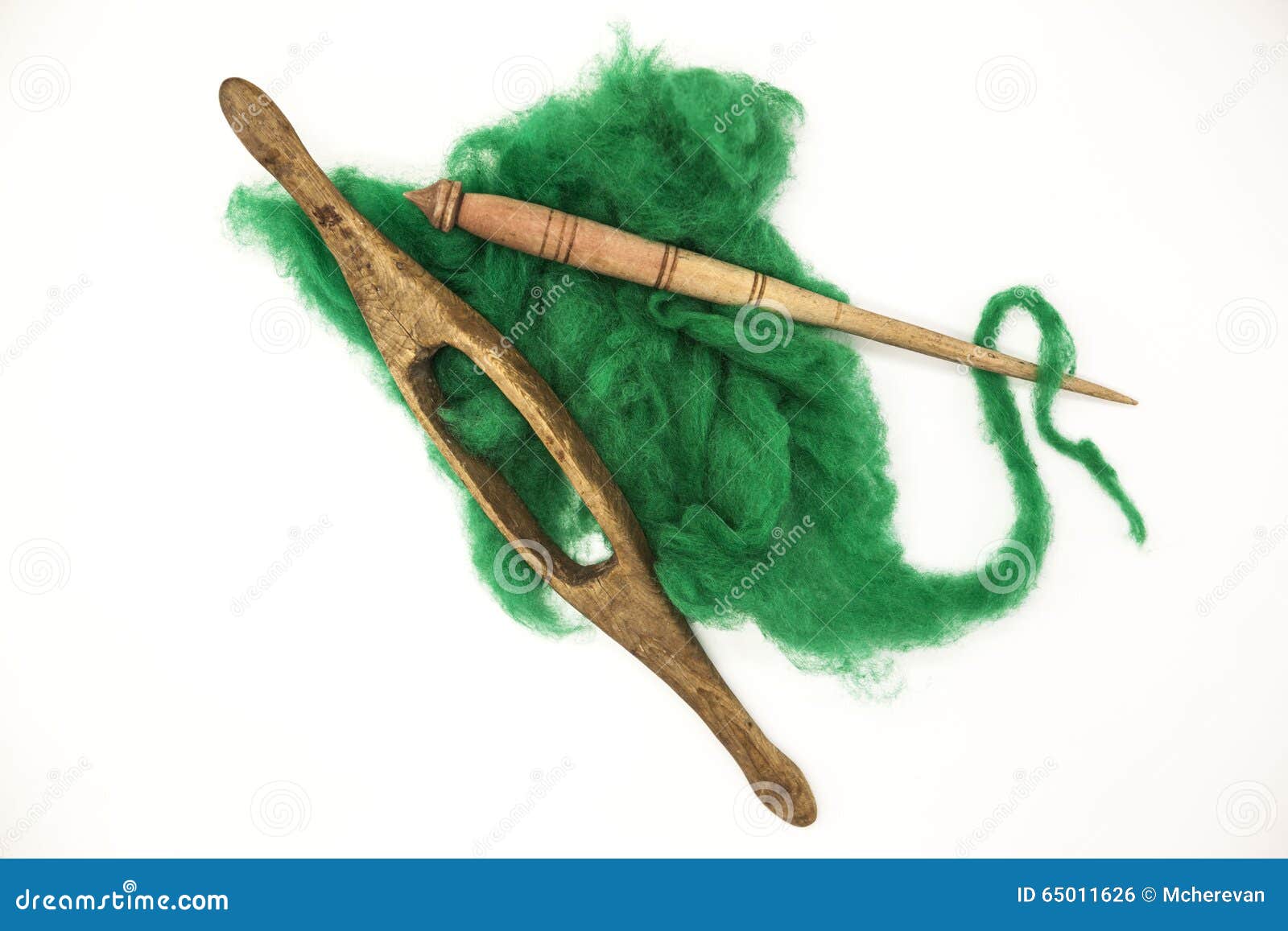 Green Wool and Old Spindle Close-up on White Background. Tools for ...