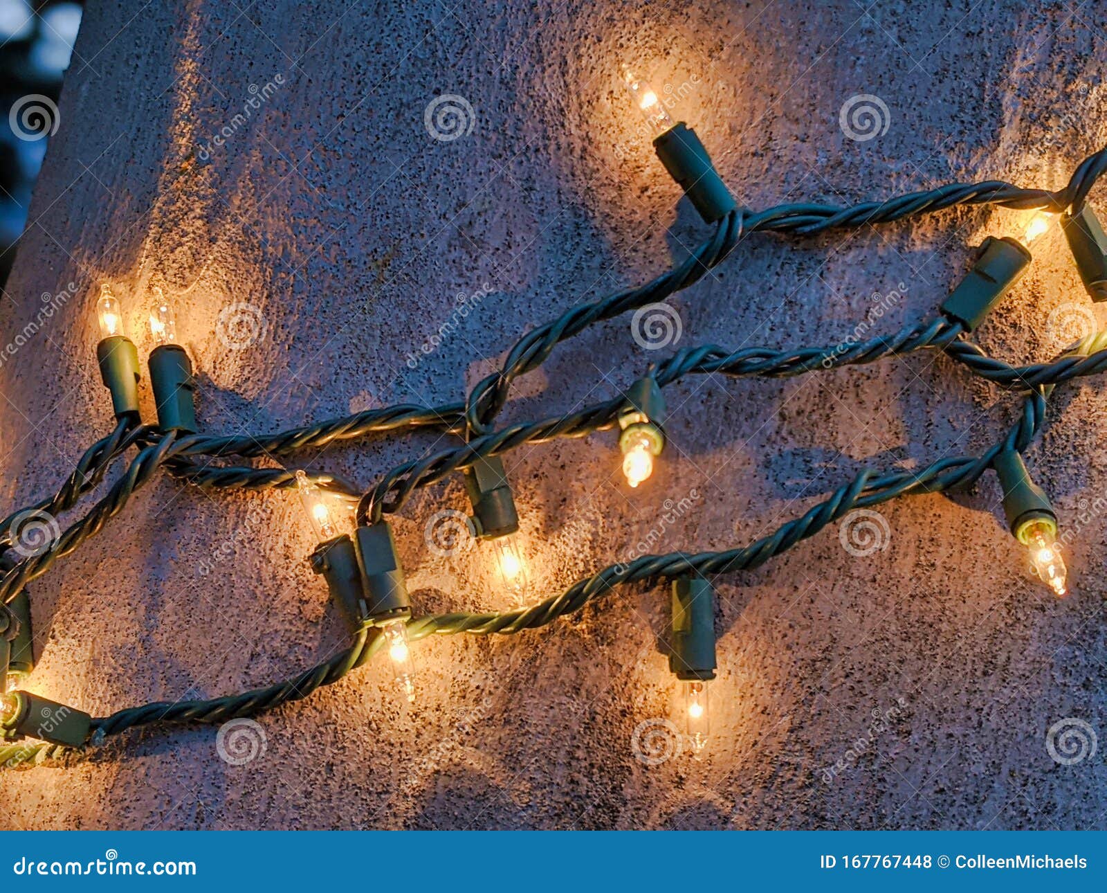 String Lights Wrapped Around a Pole Outdoors for the Holiday Season ...