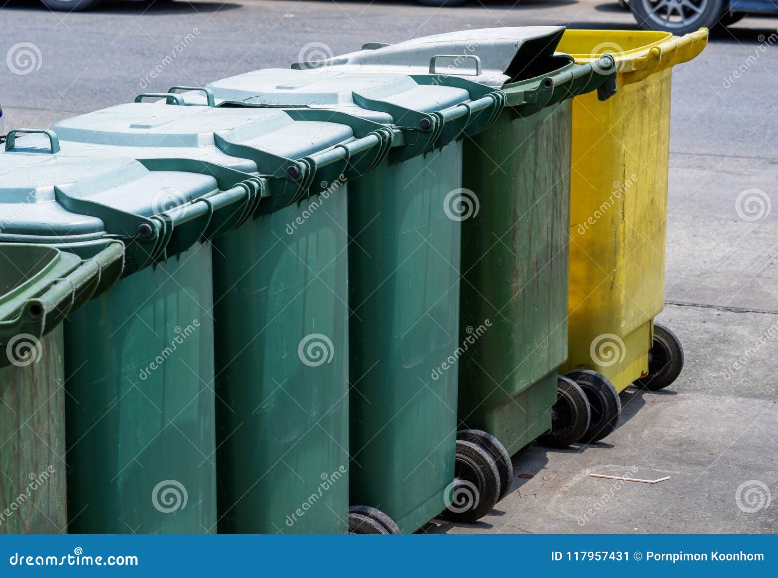 Green and yellow trash bin stock image. Image of collection - 117957431